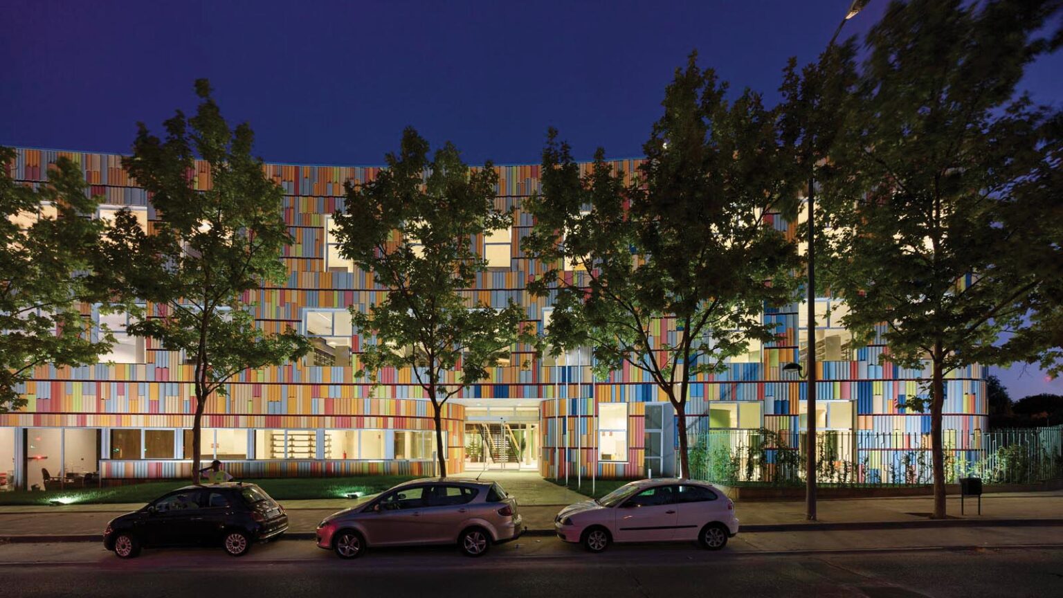 A Rainbow Facade of Terracotta Tiles Wraps a Central Library in Spain ...